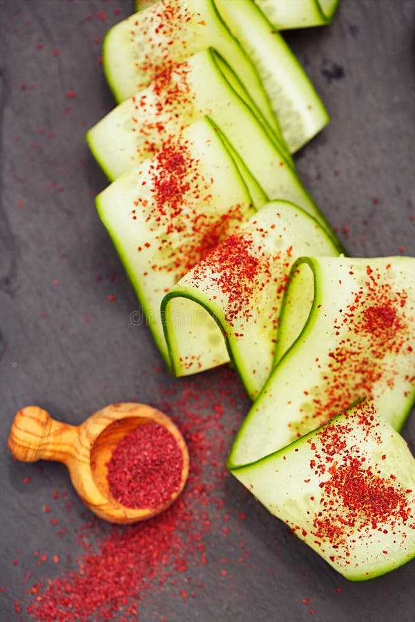 Ground Red Sumac Berries Sprinkled on Cucumber Slice Stock Image ...