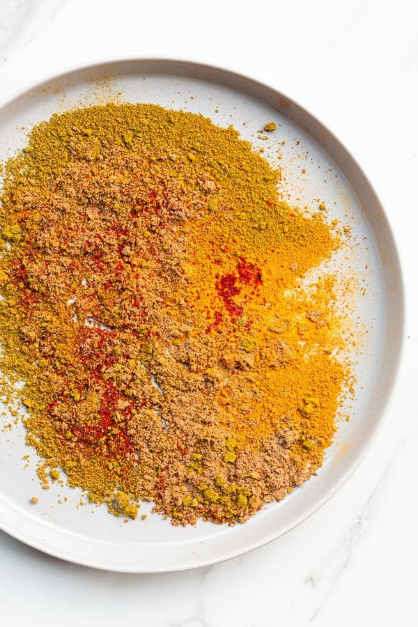 Ground spices on plate stock photo. Image of text, india - 231532264