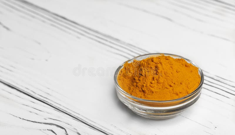 Ground Turmeric in Glass Bowl on Wooden White Table Stock Illustration ...