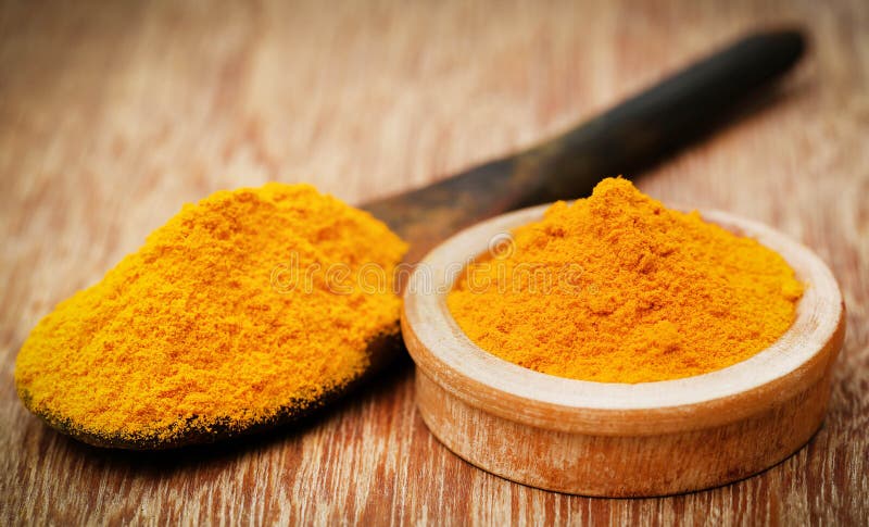 Ground Turmeric in a Spoon and Bowl Stock Photo - Image of color ...