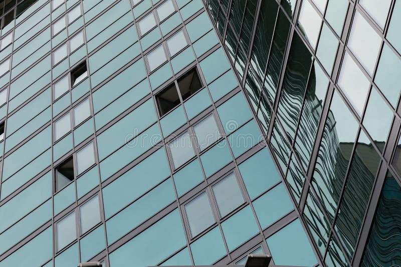 Ground View of Innovative Glass Building Facade with Some Open Windows ...