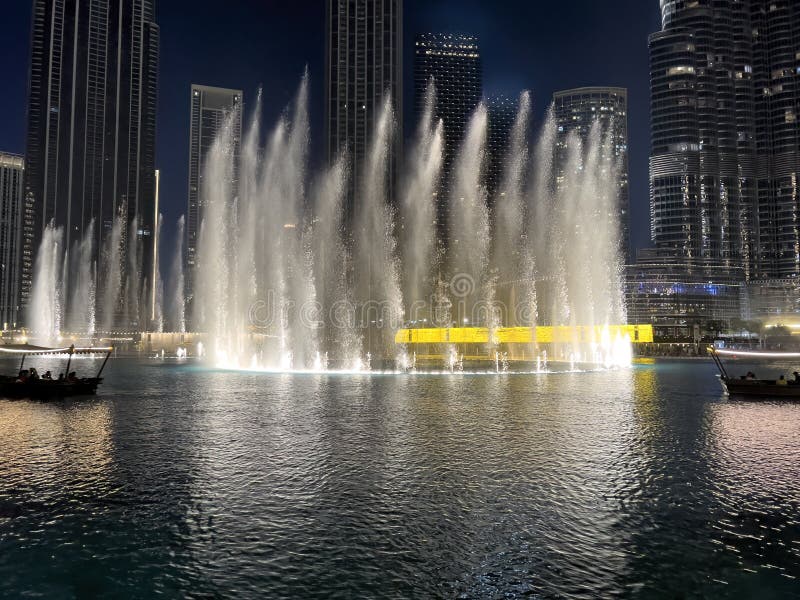 Ground View of Partial Downtown Dubai with Lighted Water Fountain at ...