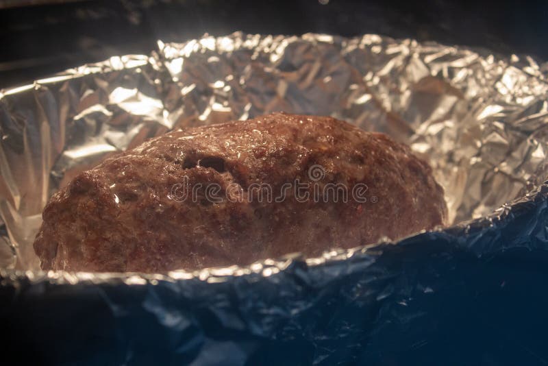 Grounded Beef Rolled with Ham and Cheese Inside, on a Foil Tray Inside ...