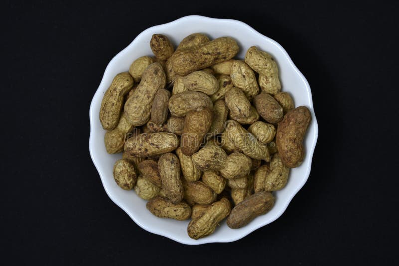Groundnut. Unpeeled Peanuts in a White Plate Stock Image - Image of ...