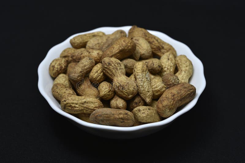 Groundnut. Unpeeled Peanuts in a White Plate Stock Photo - Image of ...