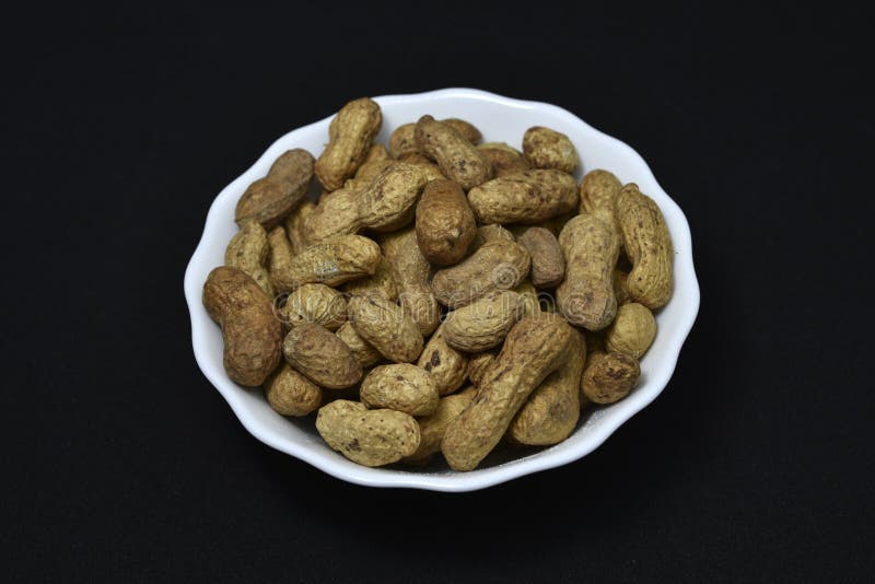 Groundnut. Unpeeled Peanuts in a White Plate Stock Photo - Image of ...