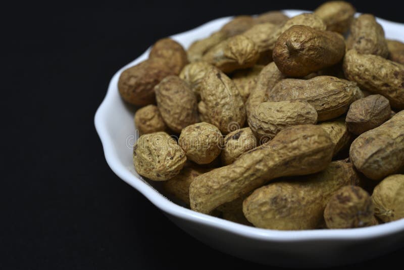 Groundnut. Unpeeled Peanuts in a White Plate Stock Photo - Image of ...