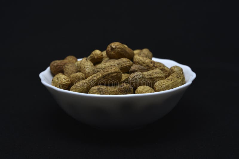 Groundnut. Unpeeled Peanuts in a White Plate Stock Photo - Image of ...