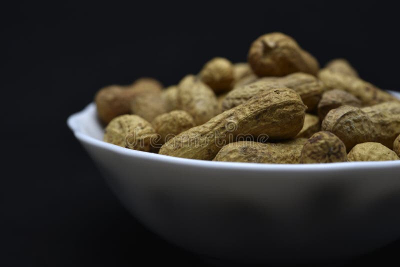 Groundnut. Unpeeled Peanuts in a White Plate Stock Image - Image of ...