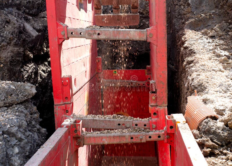 Groundworker Installing Clay Drainage Pipe while in the Trench ...