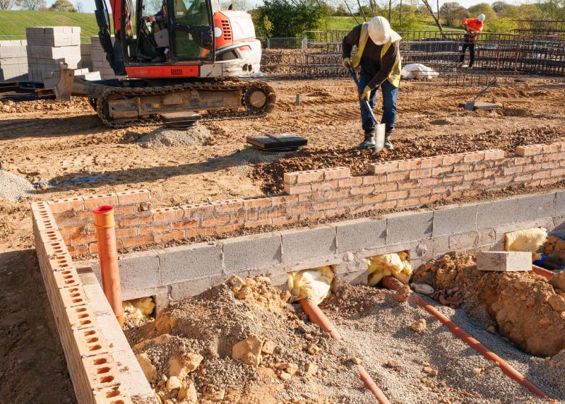 Groundworker is Installing Internal Drainage for a House. Stock Image ...