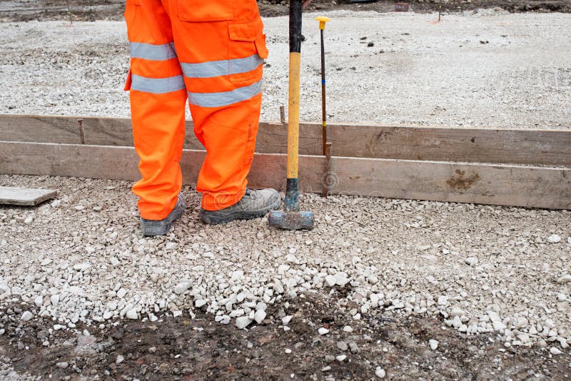 Groundworker Making Shutter for Concrete To Form a Base for Kerb Using ...