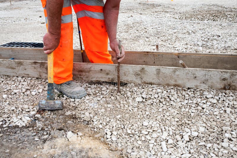 Groundworker Making Shutter for Concrete To Form a Base for Kerb Using ...