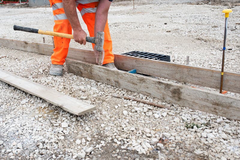 Groundworker Making Shutter for Concrete To Form Base for Kerb Using ...