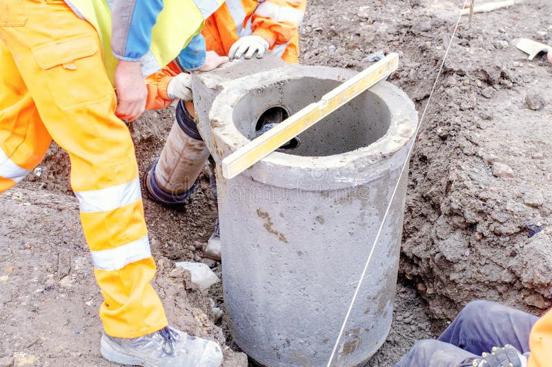 Groundworkers Installing New Road Gully during New Road Construction ...