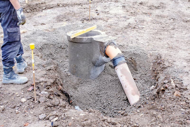 Groundworkers Installing New Road Gully during New Road Construction ...