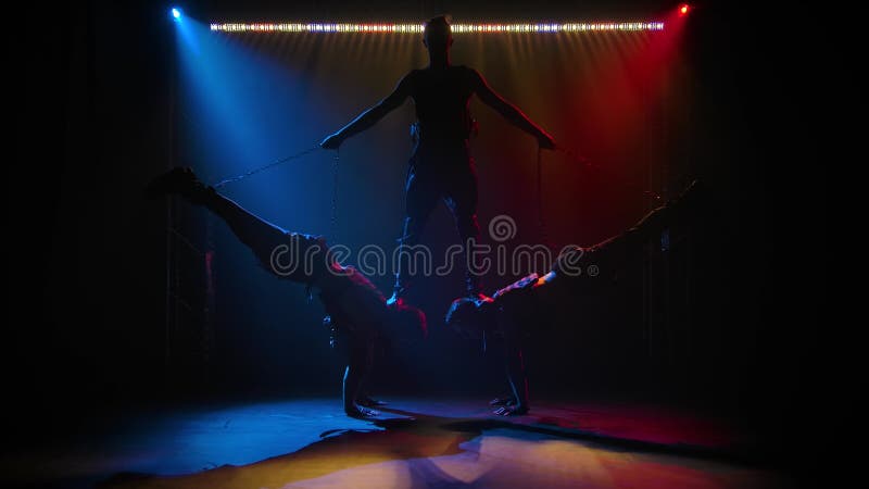 The Group of Acrobat Gymnast Men on Balance Pose. a Difficult Acrobatic ...