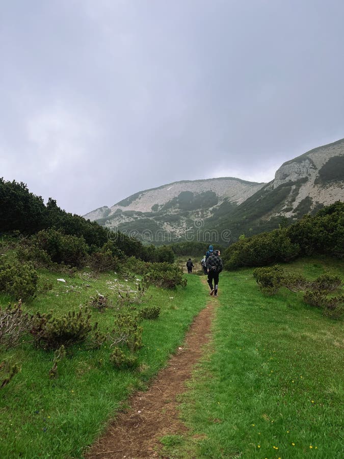People Hiking on a Narrow Path on the Mountains Editorial Photography ...