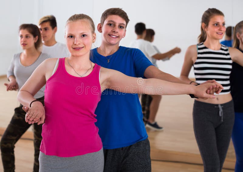 Group of Admiring Teenagers Dancing Tango in Dance Studio Stock Image ... Group of Admiring Teenagers Dancing Tango in Dance Studio Stock Image ...