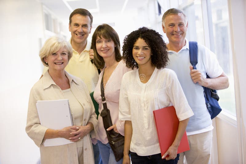 A Group of Adult Students Standing in a Corridor Stock Image - Image of ...