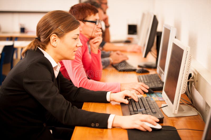 Group of Adults Learning Computer Skills. Intergenerational Tran Stock ...