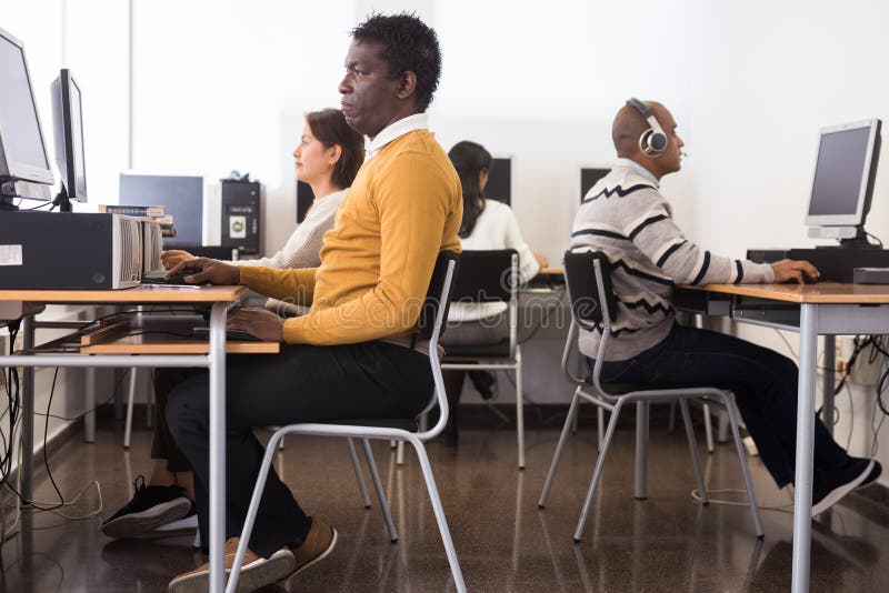 Group of Adults Working on Computers in Public Library Stock Image ...