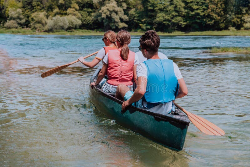 Group Adventurous Explorer Friends are Canoeing in a Wild River Stock ...