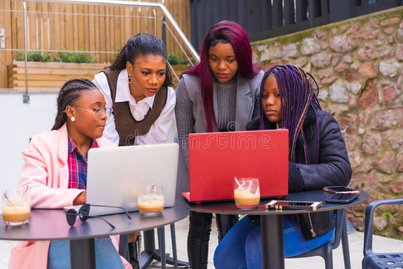 Group of African American Businesswomen during a Teamwork Stock Photo ...