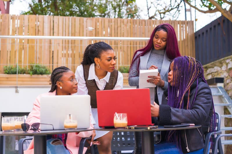 Group of African American Businesswomen during a Teamwork Stock Photo ...