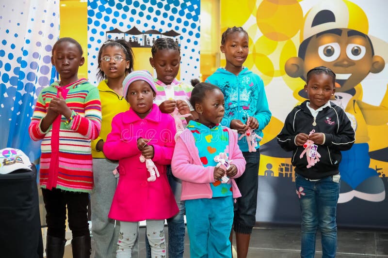 Group of African American Children with Prizes Posing at an Event ...