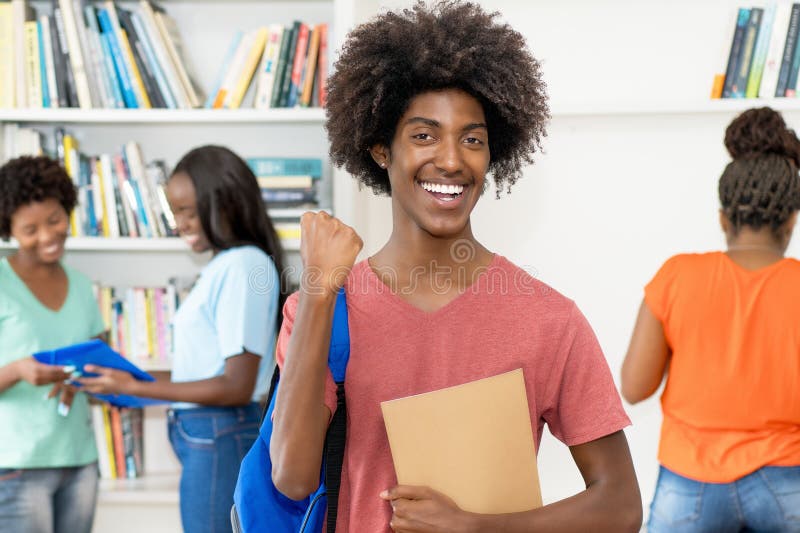 Pretty Black Female Student at Desk with Group of Learning African ...