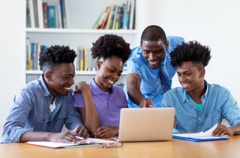 Group of African American Students with Male Teacher Stock Image ...