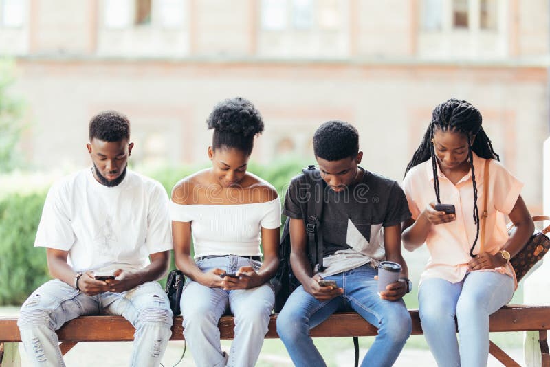 Group of African Students Social Networking Using Several Tech Devices ...