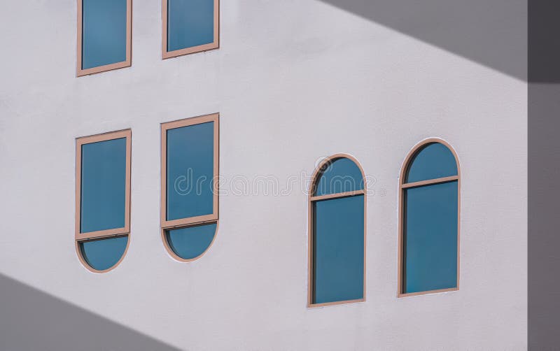 Group of Arch Glass Windows on Modern Beige Building Wall with Sunlight ...