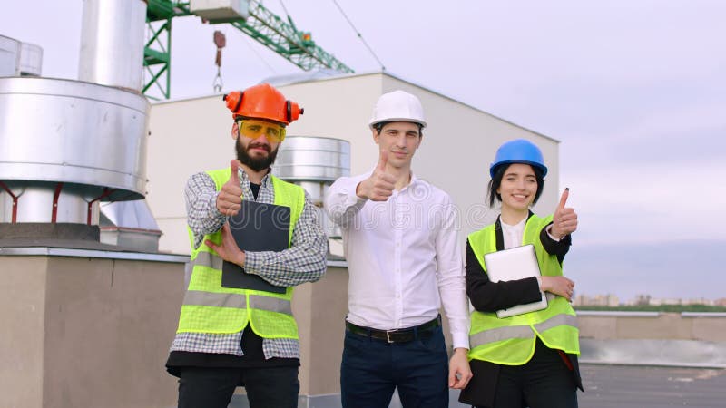 Group of Architect and Engineers in Front of the Camera Looking ...