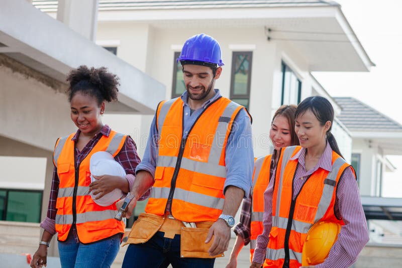 A Group of Architects and Construction Workers are Inspecting the ...