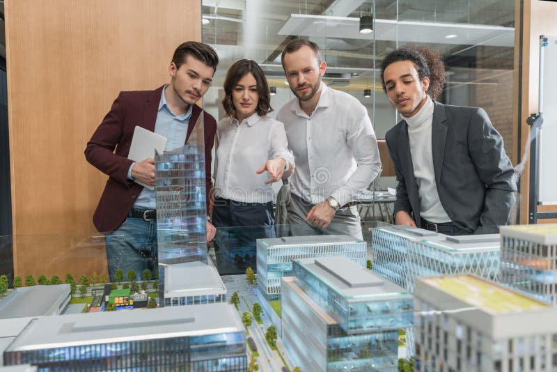Group of Architects Discussing Building Models Stock Photo - Image of ...