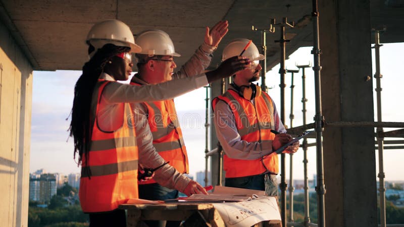 Group of Architects are Talking in a High-rise Building in Progress ...