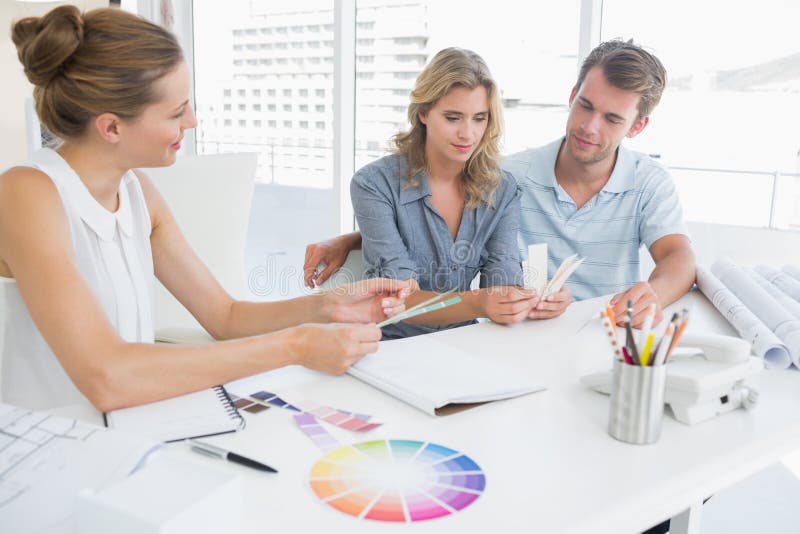 Group of Artists Working on Designs Stock Photo - Image of desk ...