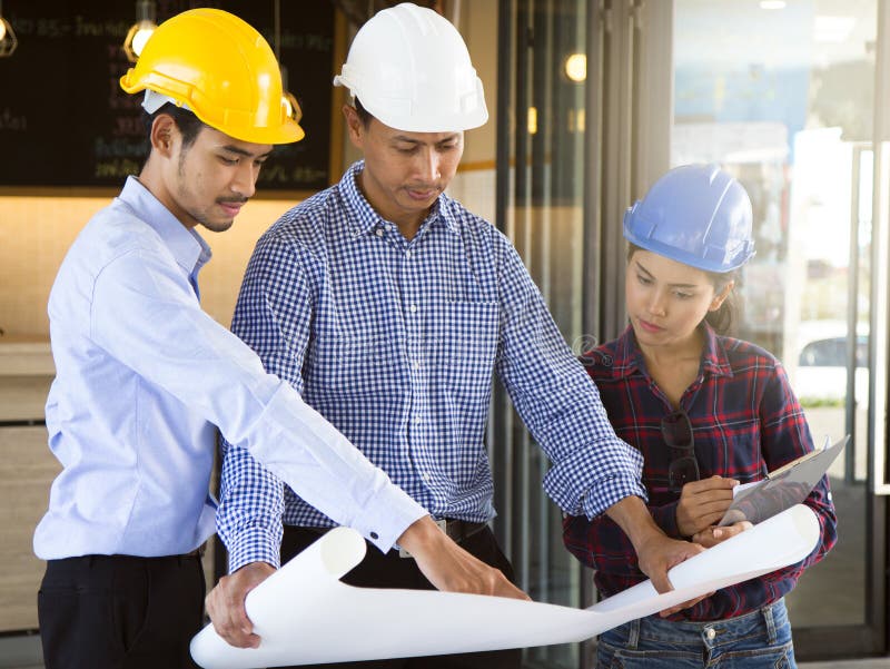 Group of Asian Architect/engineer/foreman Explaining Progress of Work ...