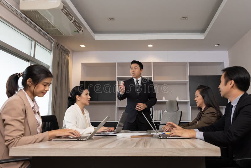 Group of Asian Business Team Having a Meeting Stock Photo - Image of ... Group of Asian Business Team Having a Meeting Stock Photo - Image of ...