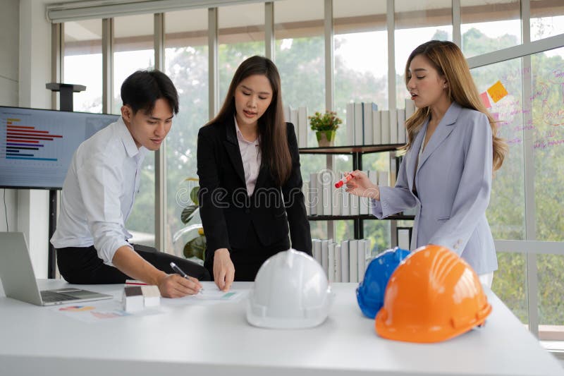 Group of Asian Businesspeople and Engineers Working and Brainstorming ...