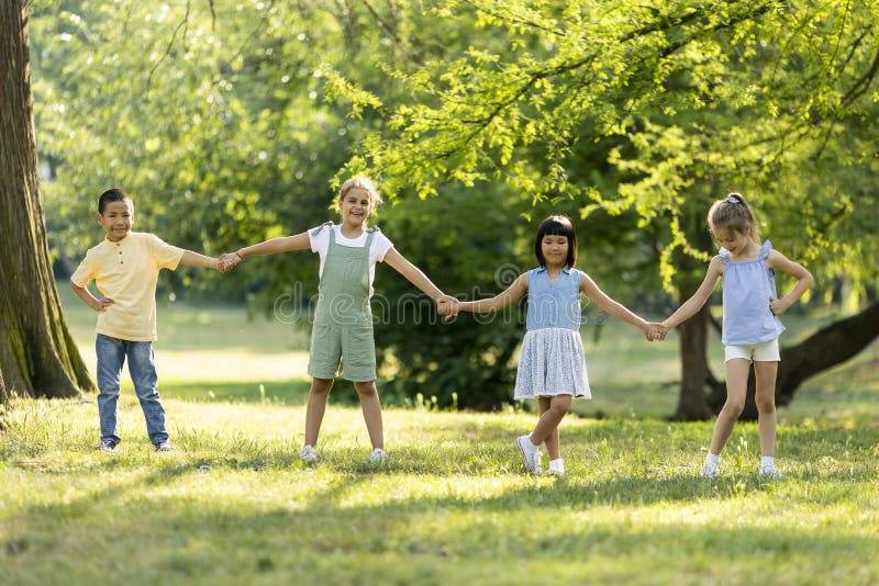 Group of Asian and Caucasian Kids Having Fun in the Park Stock Image ...