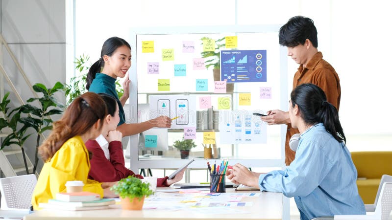 Group of Asian Creative Design Meeting Brainstorm Ideas To Plan and ...