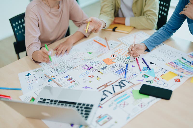 Group of Asian Creative Team Programing Designers Participate in All Phases of the UX UI Design ...