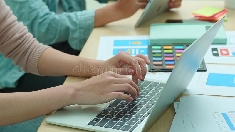 Group of Asian Creative Team Programing Using Computer while Designers ...