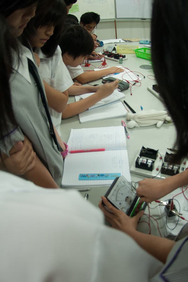 Group of Asian Elementary Students are Learning about Electricity in ...