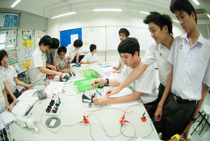 Group of Asian Elementary Students are Learning about Electricity in ...