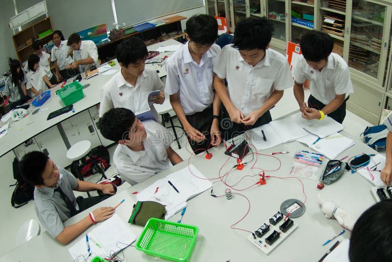 Group of Asian Elementary Students are Learning about Electricity in ...