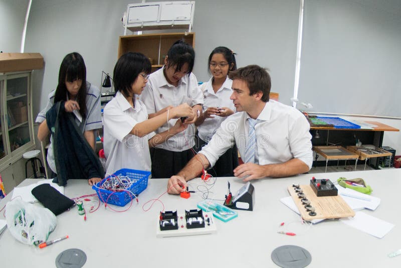 Group of Asian Elementary Students are Learning about Electricity in ...